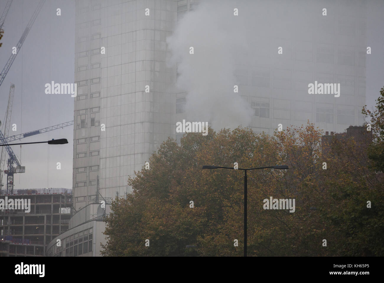London, UK. 14th Nov, 2017. Acrid smoke rises from the roof of a tower ...