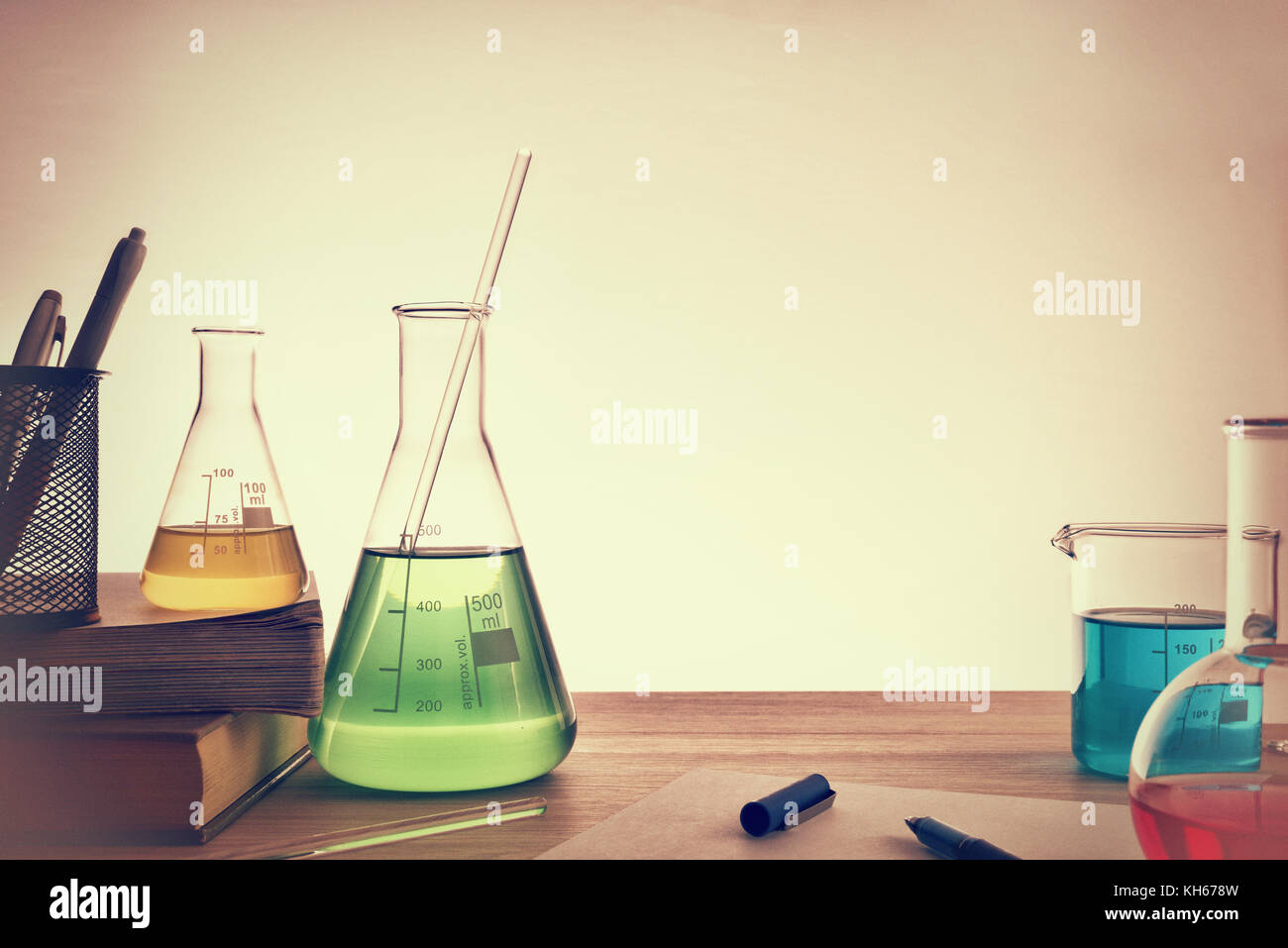 Classroom desk of chemistry teaching with books and instruments ...