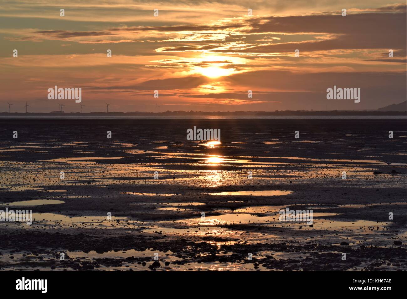 sunset over beach Stock Photo - Alamy