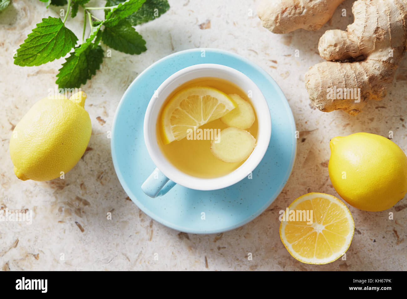 Lemon and ginger tea with honey. Cup of hot honey lemon tea with fresh ...