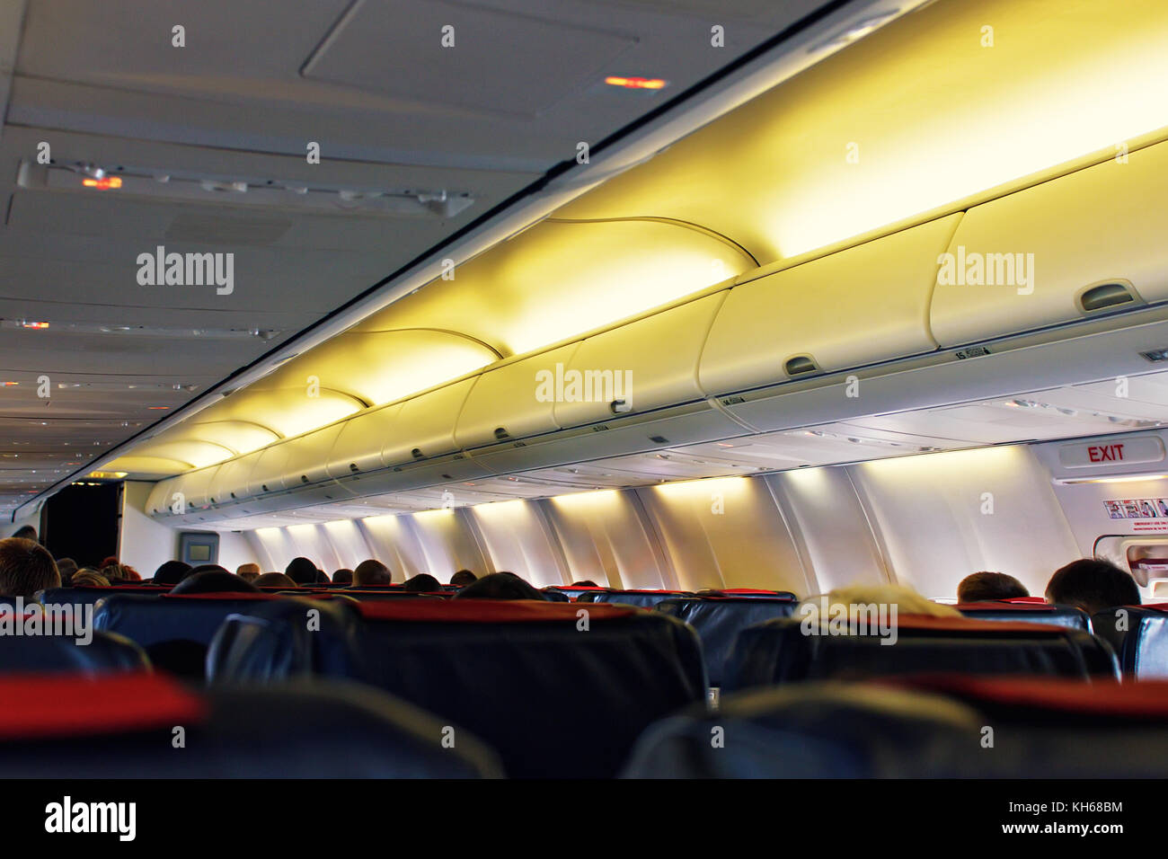 Passenger seat, Interior of airplane with passengers sitting on seats ...