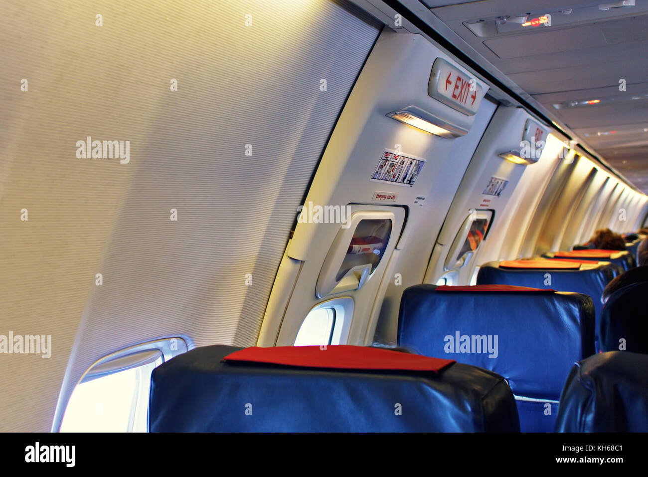 Passenger seat, Interior of airplane with passengers sitting on seats ...