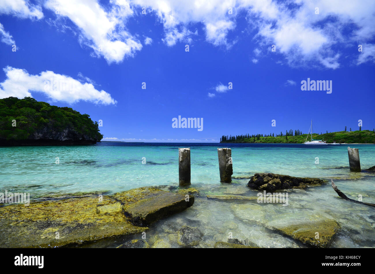 Isle of Pines,Kanumera Bay with yacht in background at Ilse of Pines ...