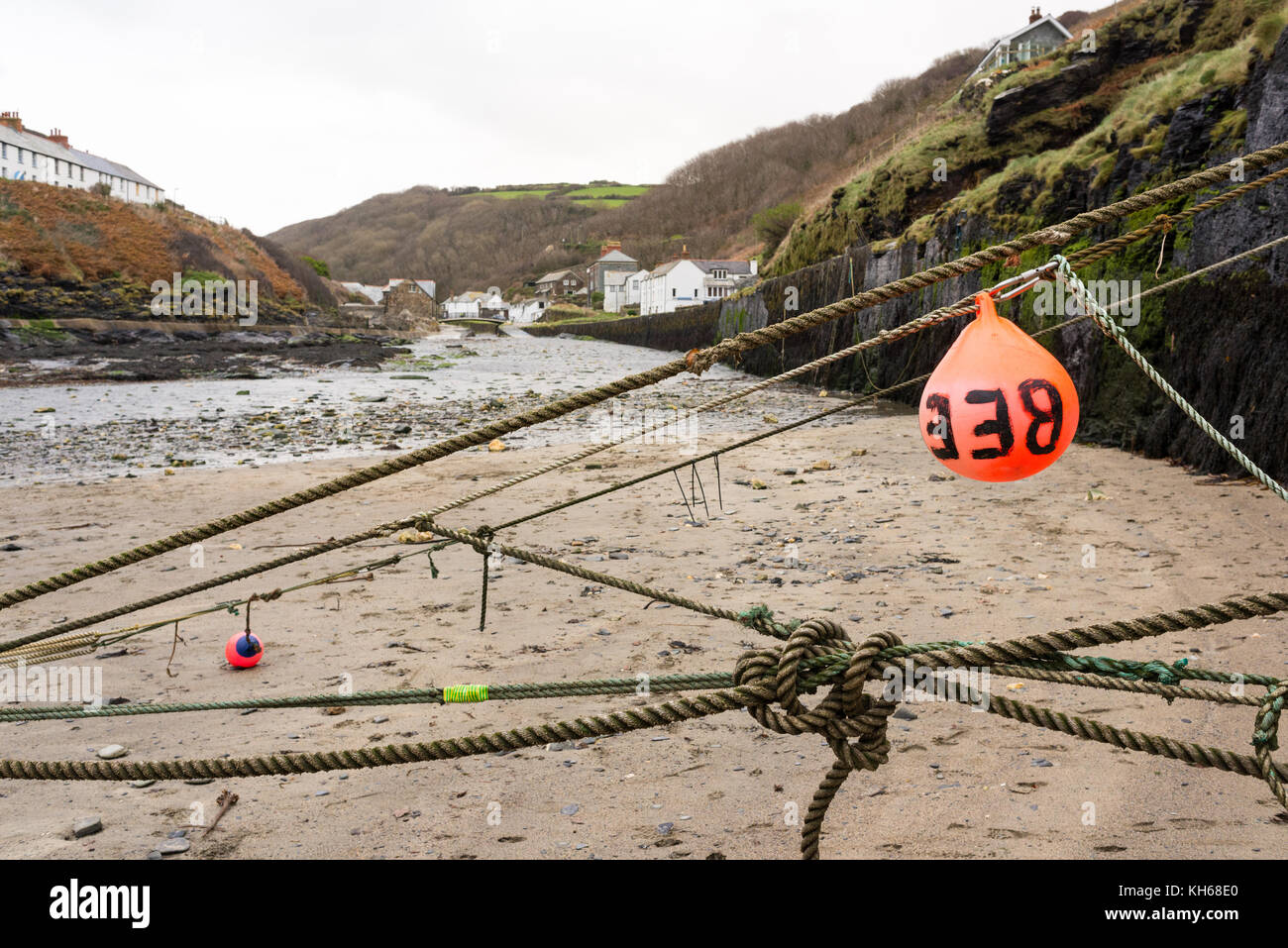 Boat ropes at low tide in the narrow cove of Boscastle, northeast ...