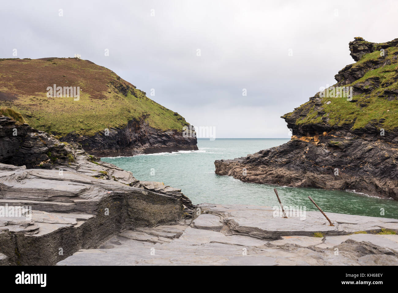 Slate and granite rocks and cliffs at the opening of the cove at ...