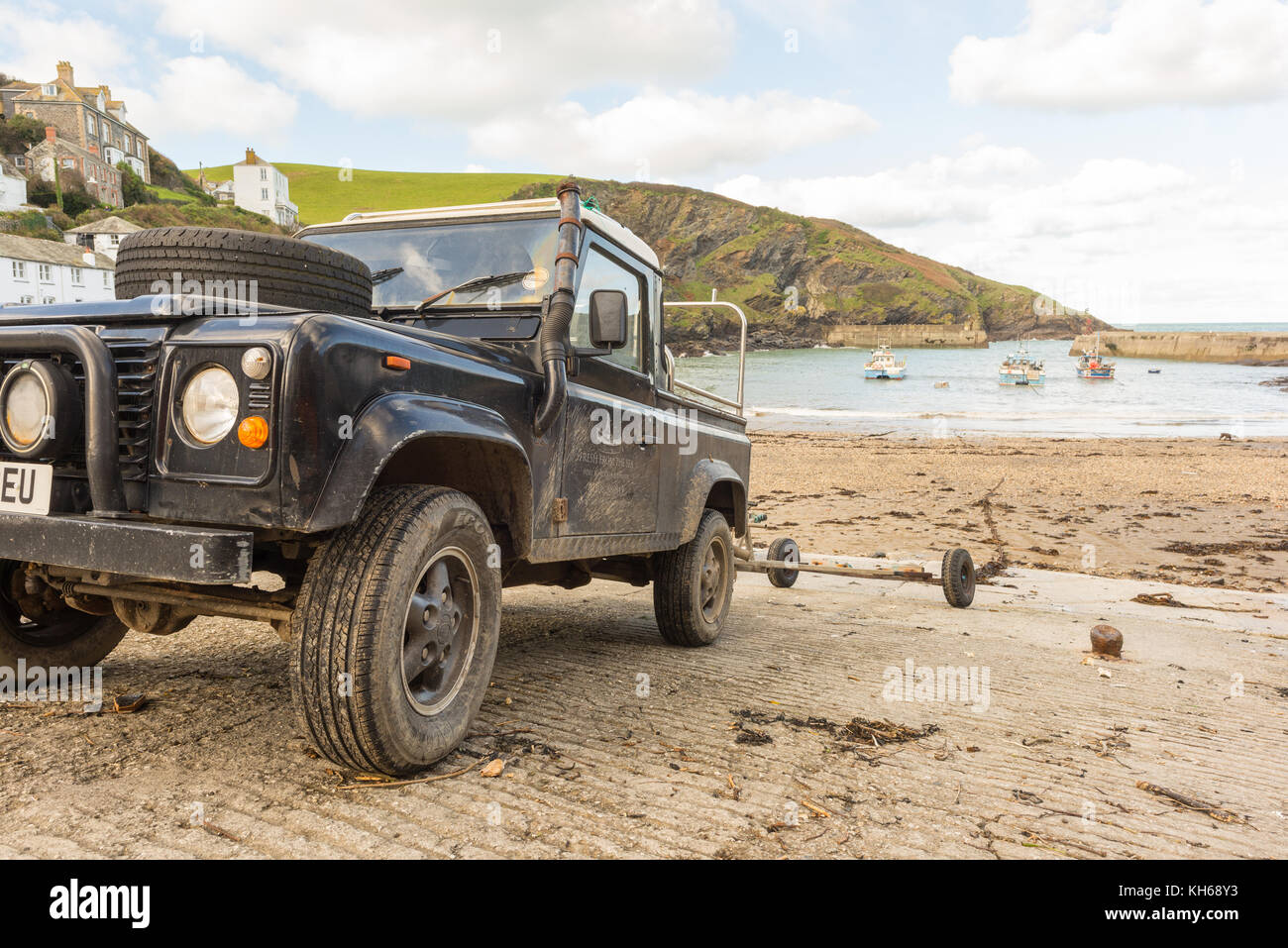 Land Rover with a boat trailer parked on the slipway of the fishing ...