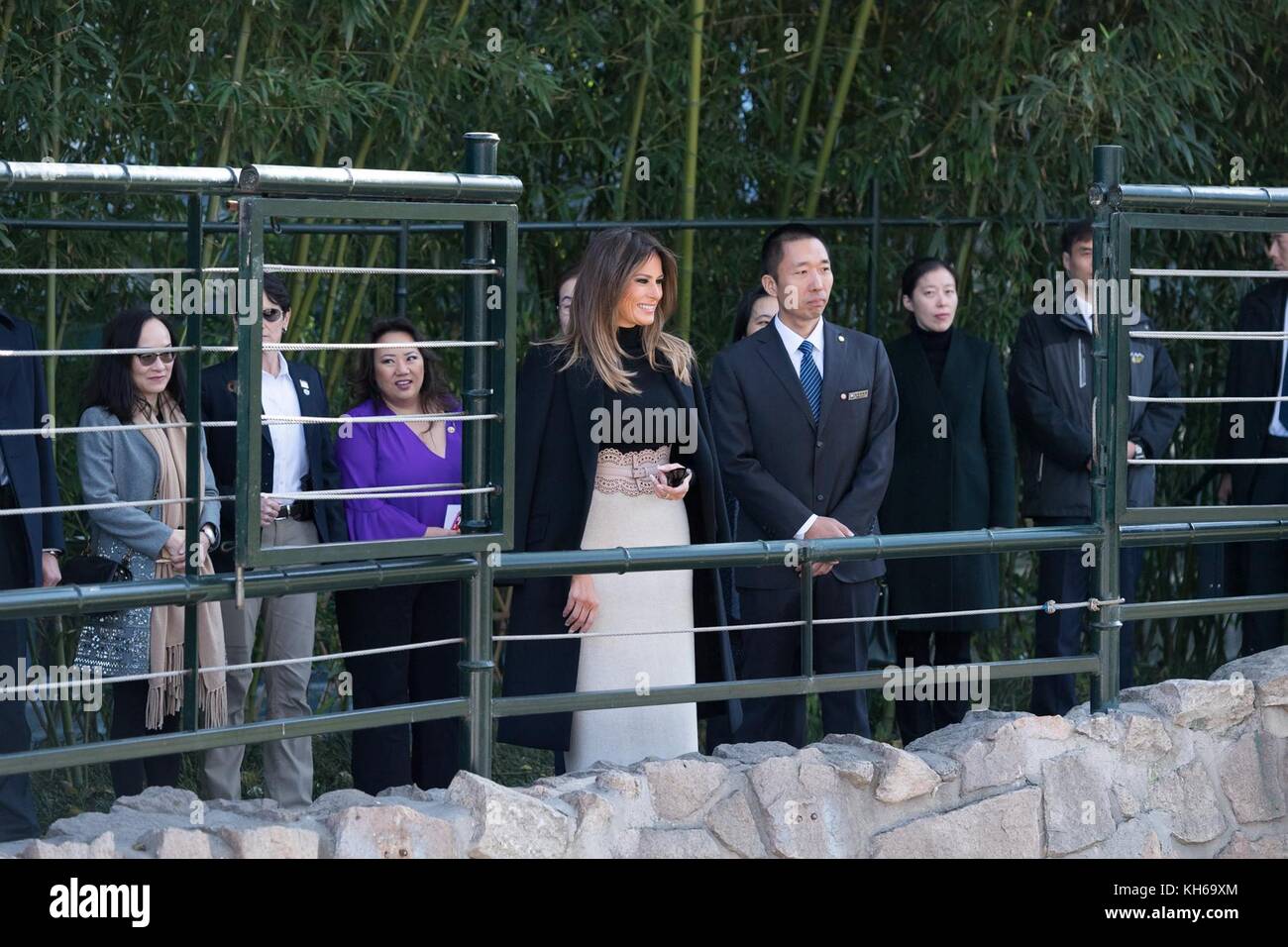 U.S First Lady Melania Trump, left, and Zoo Director Li Xiaoguang look ...