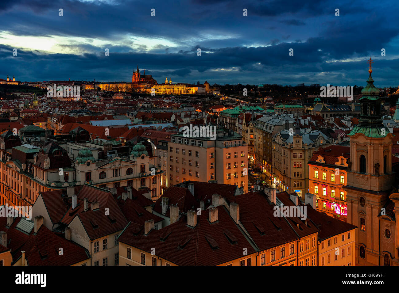 Rooftop evening view of typical buildings of Old Town and Prague Castle ...