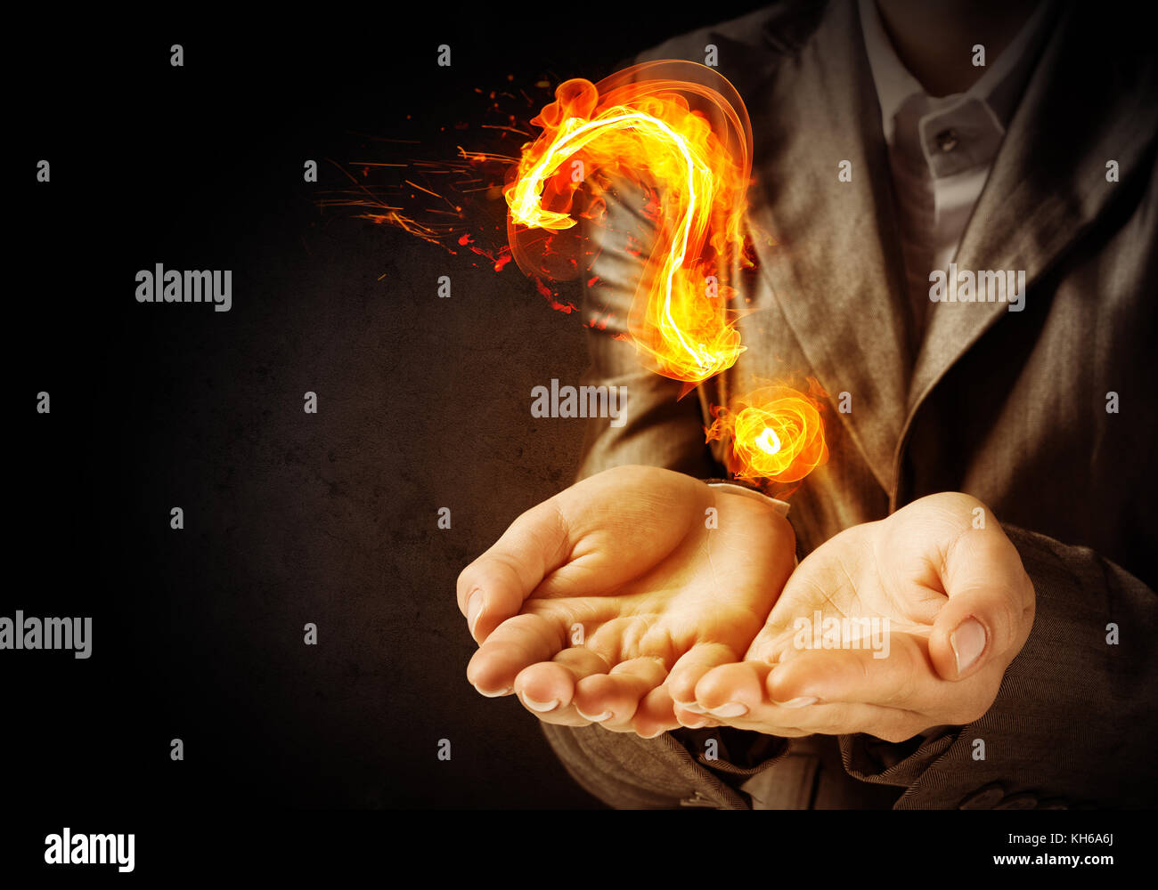 Businessman presenting question mark Stock Photo - Alamy