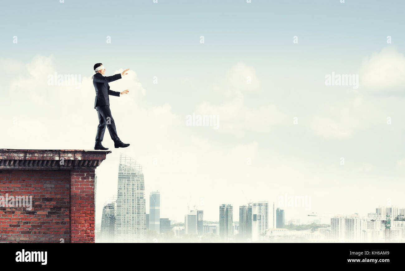 Danger and risk concept with businessman making step from edge Stock ...