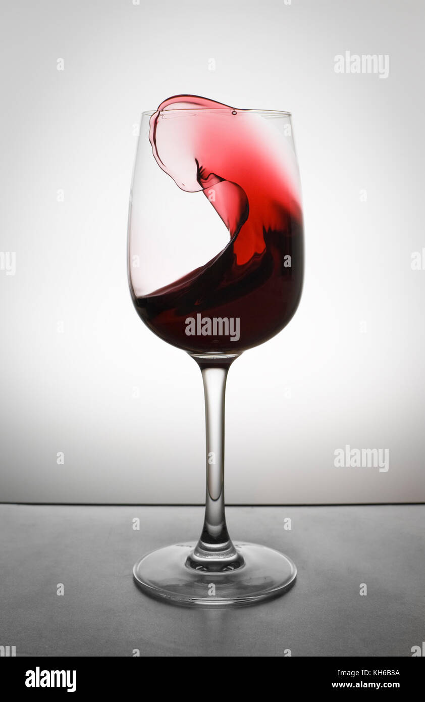 red wine splashing in glass Stock Photo - Alamy