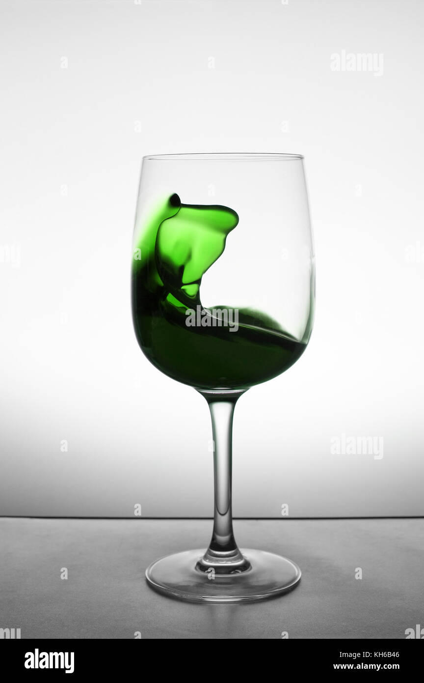 glass of green alcohol Stock Photo - Alamy