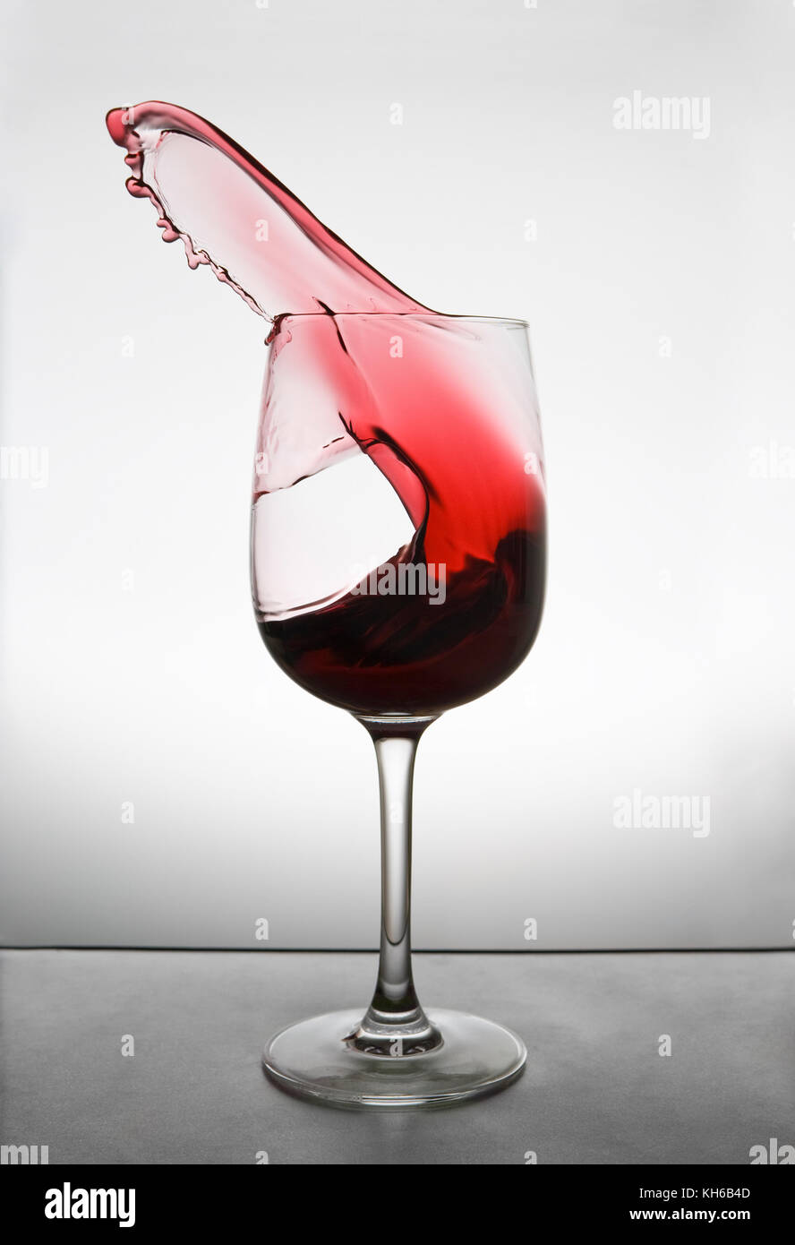 red wine splashing in glass Stock Photo - Alamy
