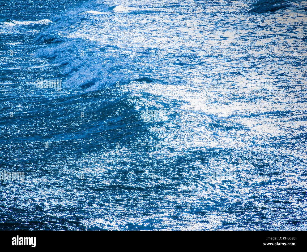 Stylised / treated image of churning sea / rough sea waves off Newquay ...