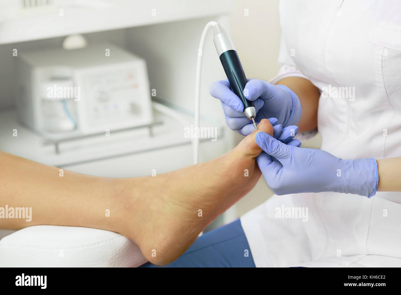 Professional hardware pedicure using electric machine.Patient on ...