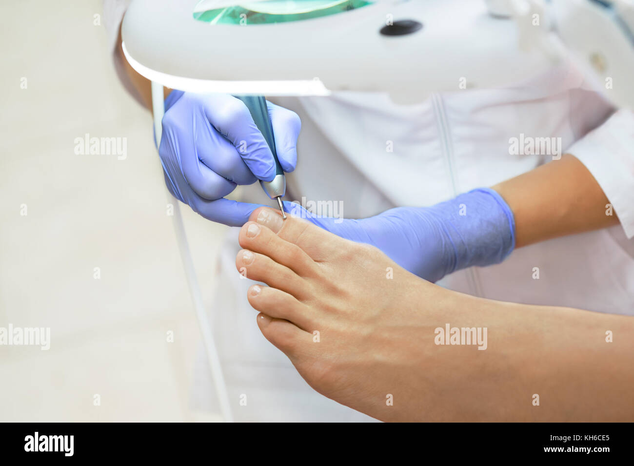 Professional hardware pedicure using electric machine.Patient on ...