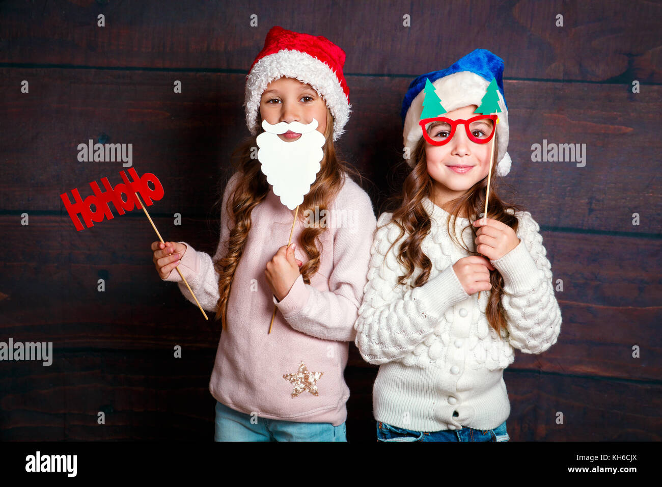 Two little smiling girls having fun .Christmas concept. Smiling funny ...
