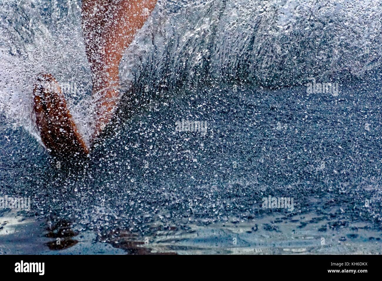 action shot of water skier's legs with spray and splash Stock Photo - Alamy