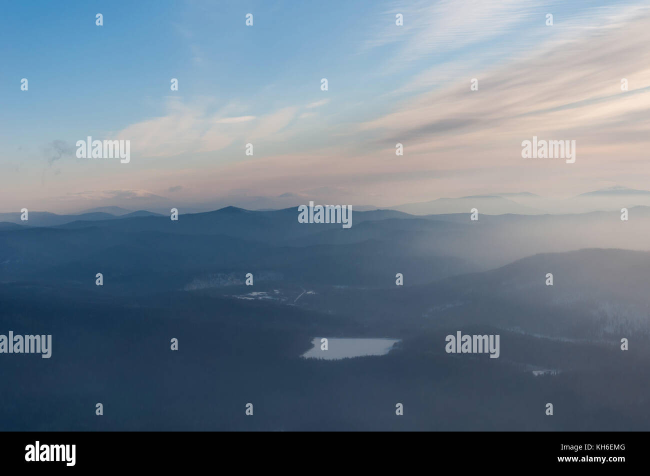 Top view of the outlines of the mountains and the valley at sunrise ...