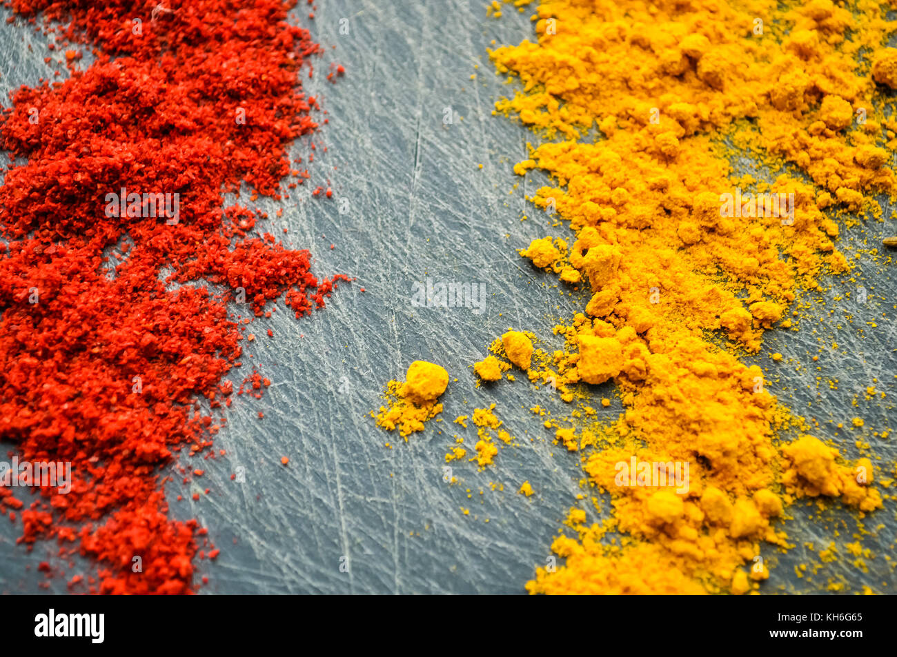 Eastern condiments scattered on a table at home. Turmeric and pe Stock ...
