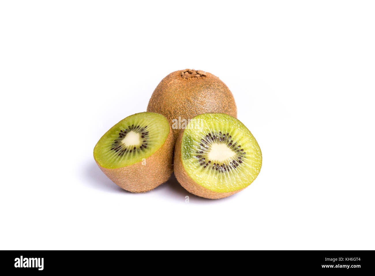 One whole kiwi and one kiwi cut in half isolated on white background ...