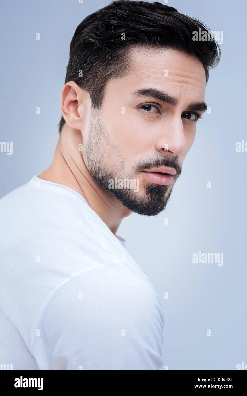 Smart handsome manager looking confident while being at work Stock ...