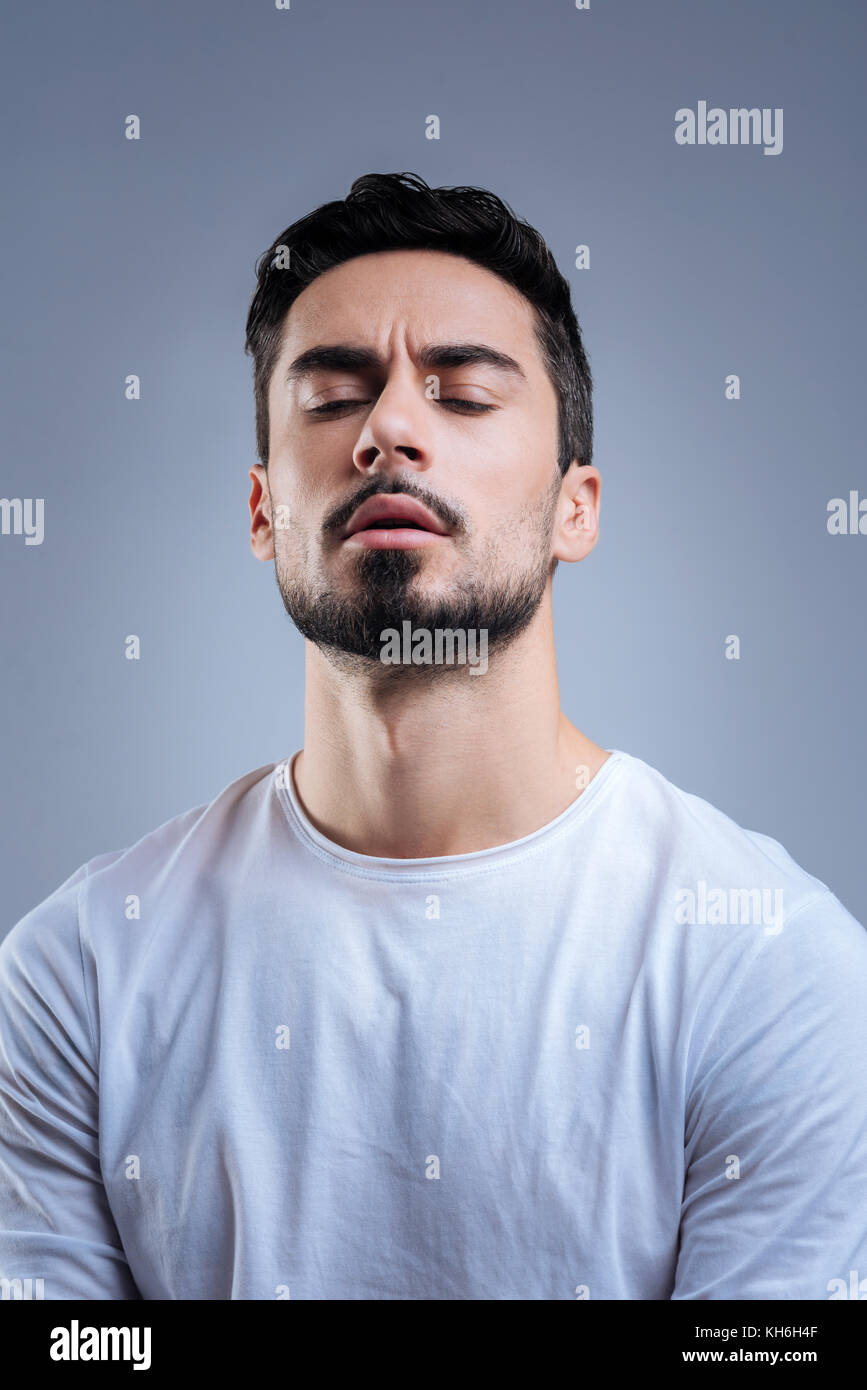 Emotional man feeling good while hearing his favorite song Stock Photo ...