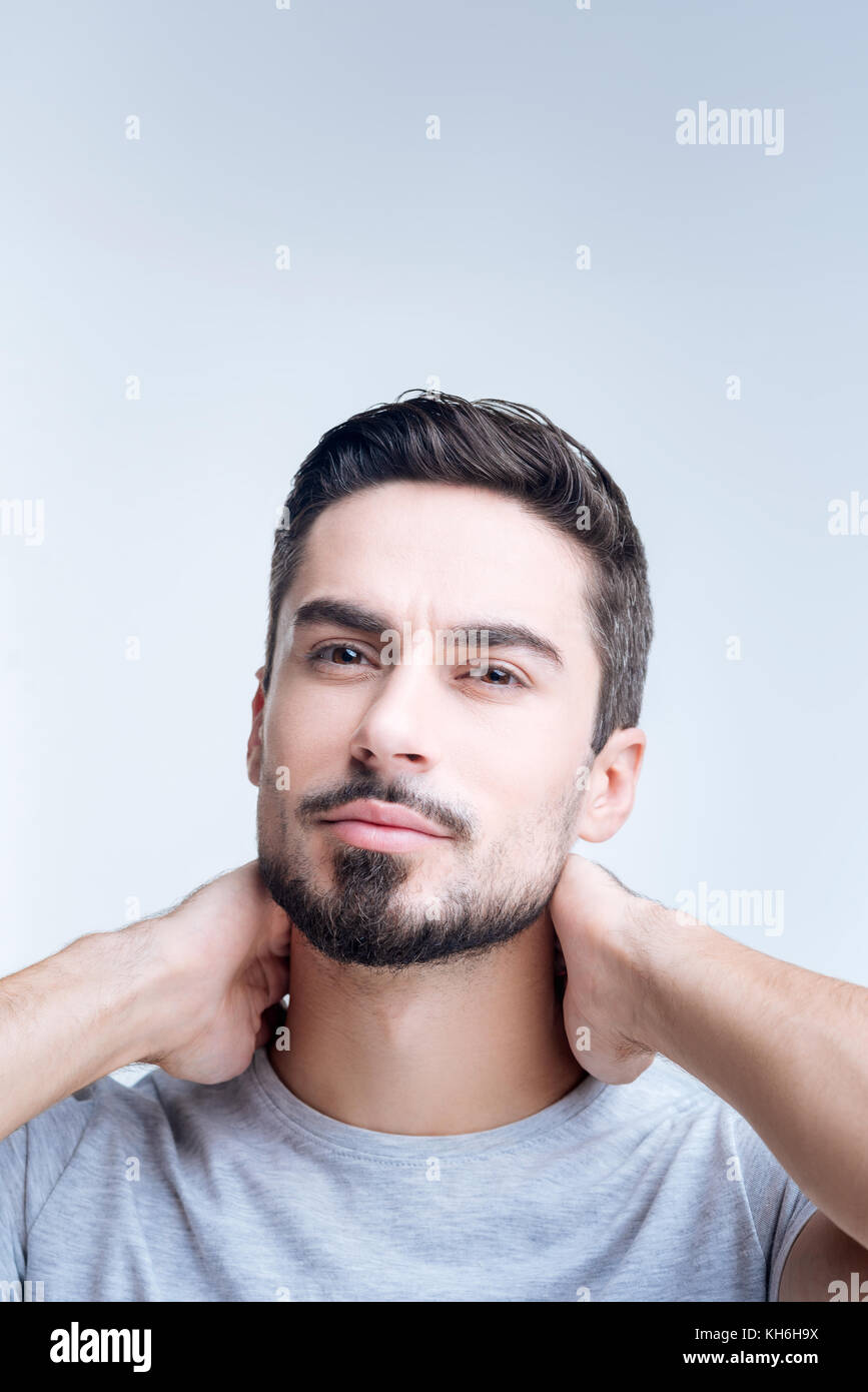 Cheerful young man feeling good while having his weekend Stock Photo ...