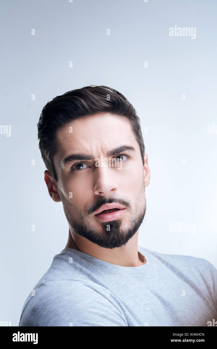 Surprised young man looking hi-res stock photography and images - Alamy