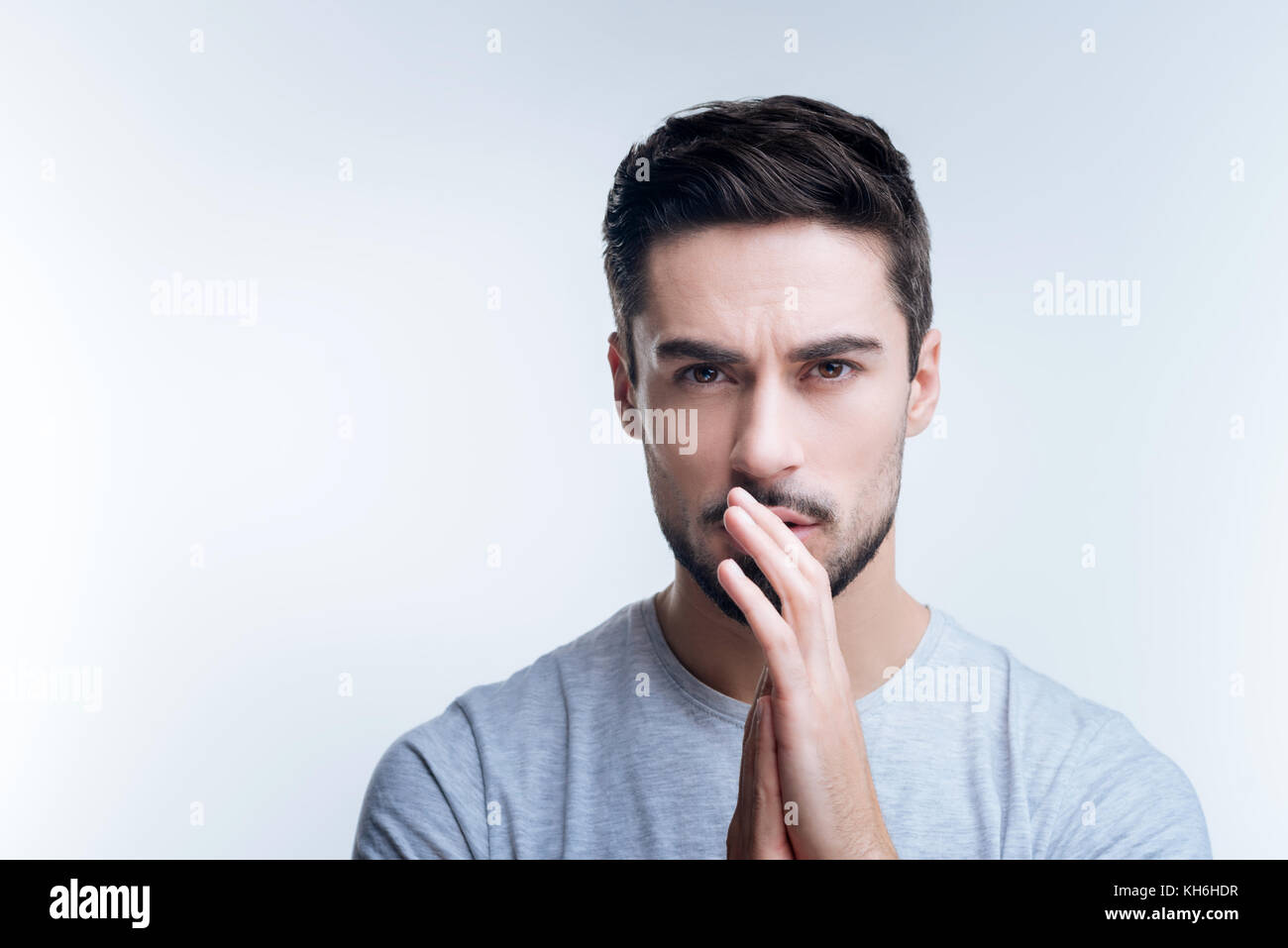Gloomy handsome man looking disappointed and sad Stock Photo - Alamy