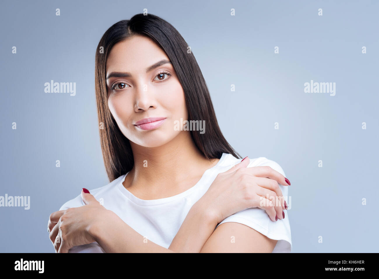 Cheerful kind woman smiling while wearing new clothes Stock Photo - Alamy