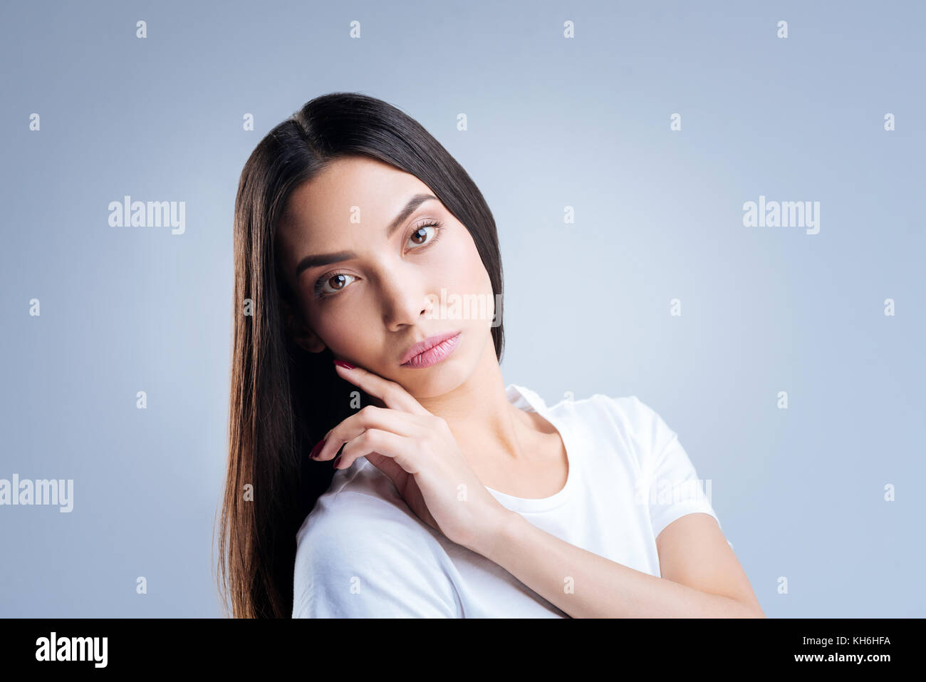 Beautiful calm woman leaning her head back while posing Stock Photo - Alamy