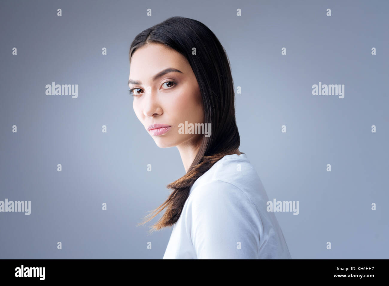 Young mysterious woman turning while walking Stock Photo - Alamy