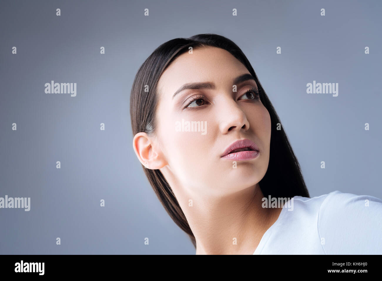 Emotional beautiful young woman looking into the distance Stock Photo ...