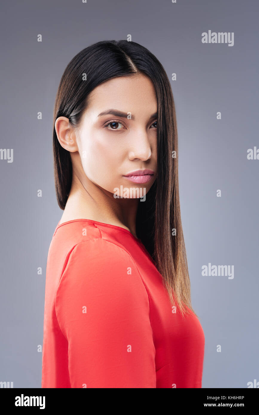Strict calm teacher standing and posing for a school album Stock Photo ...
