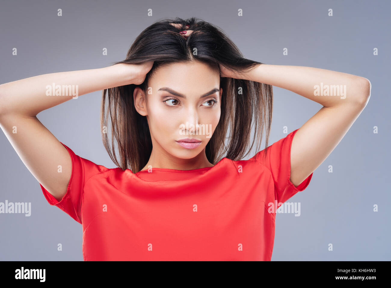 Young woman being not satisfied with her new shampoo Stock Photo - Alamy