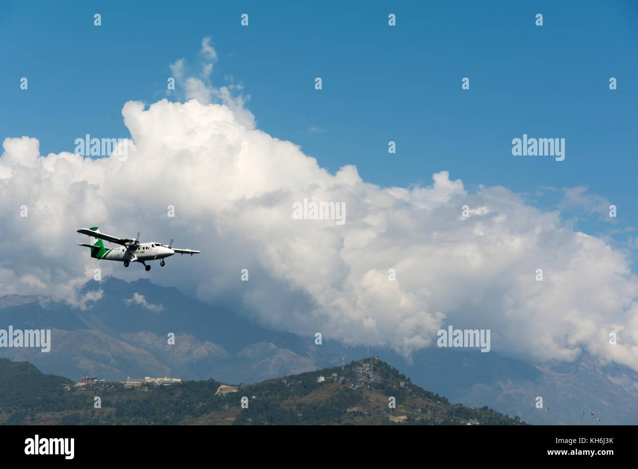 Domestic 19-seater aircraft of Nepal flying across Pokhara Stock Photo ...
