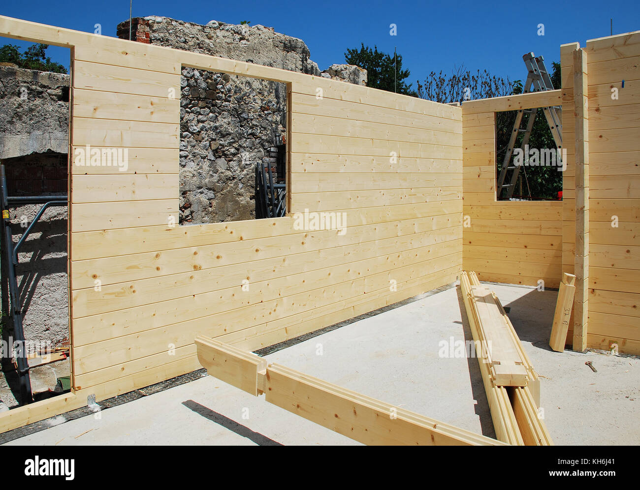 Empty front door and wondow frames inside a partially constructed wood ...