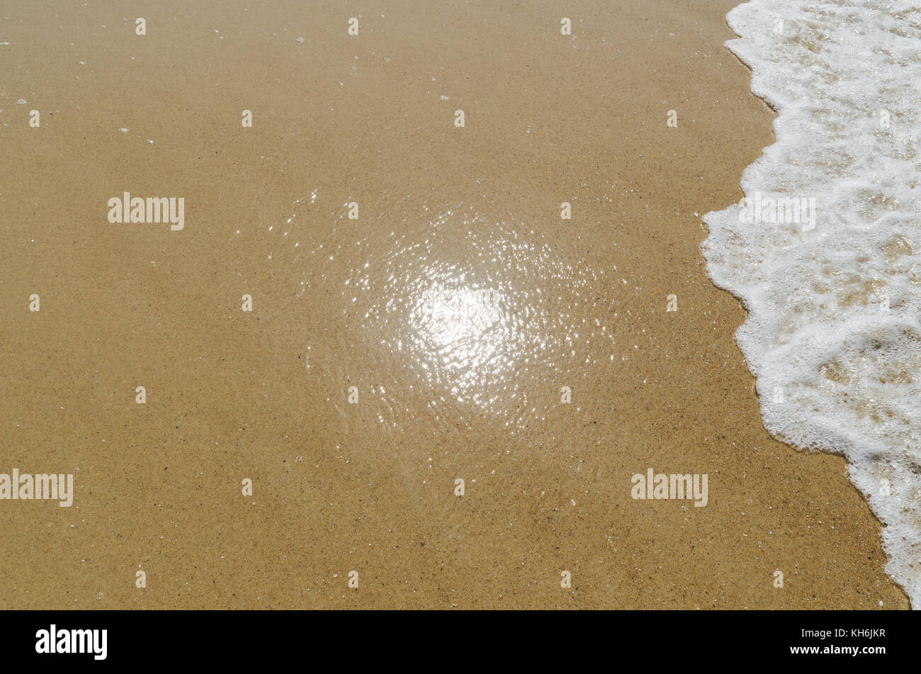 sun reflection in sand on the beach Stock Photo - Alamy