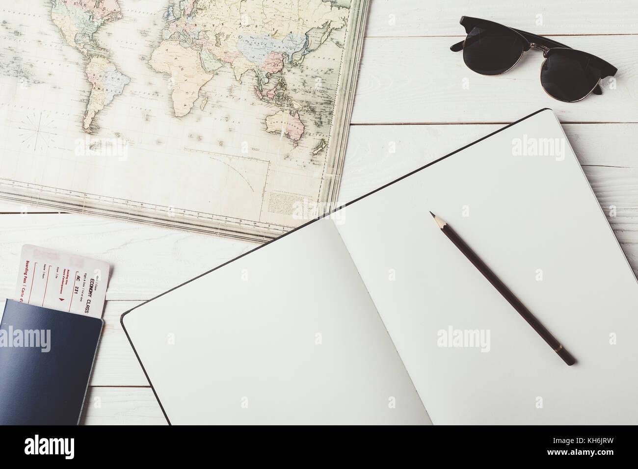 Map with notebook and pencil Stock Photo - Alamy