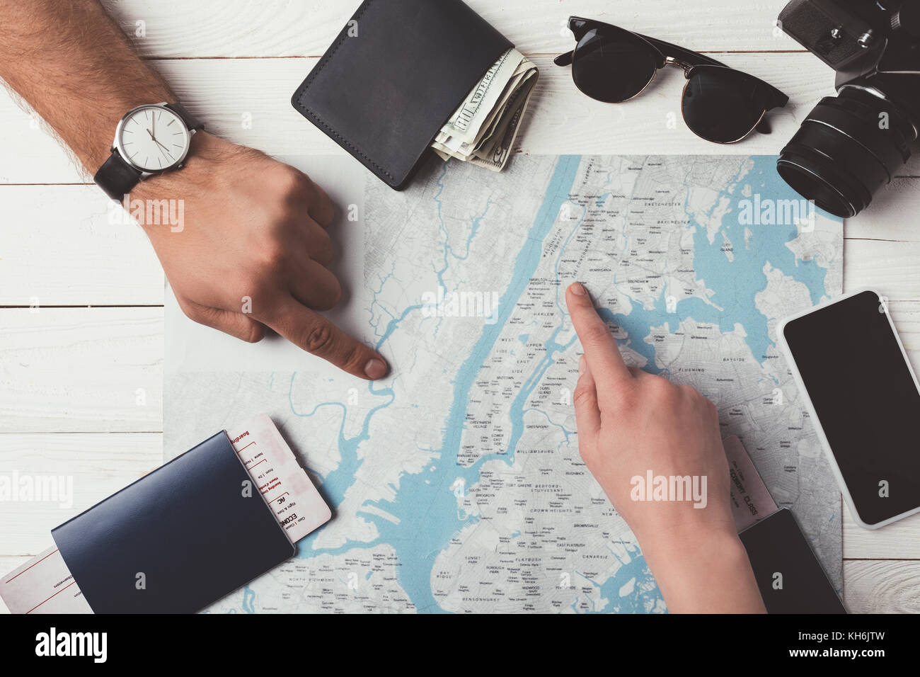 couple showing something on map Stock Photo - Alamy
