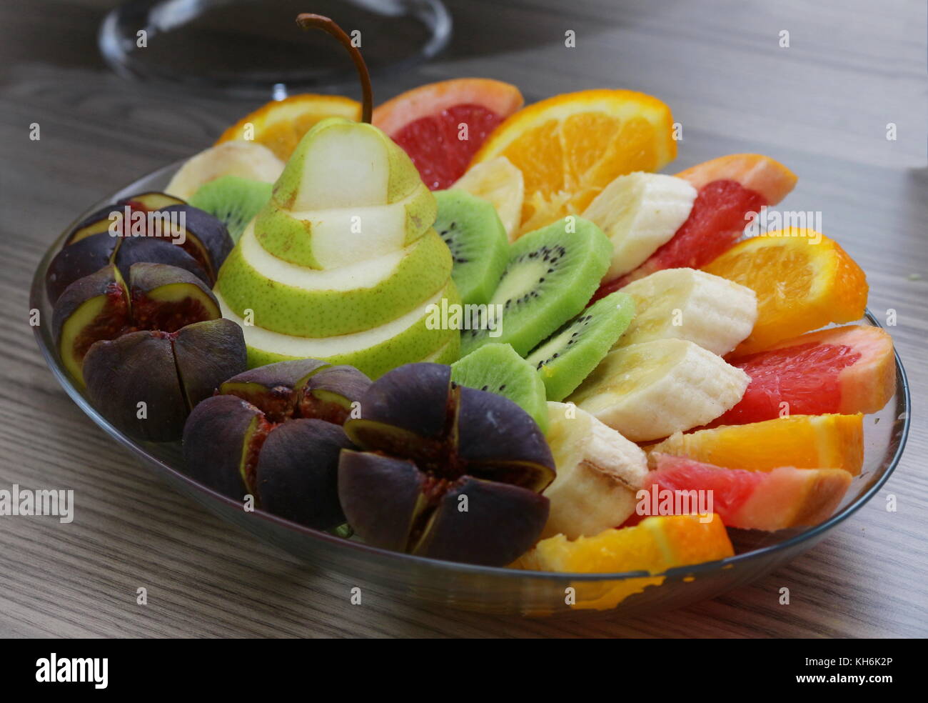 Sliced healthy fresh fruit on plate Stock Photo - Alamy