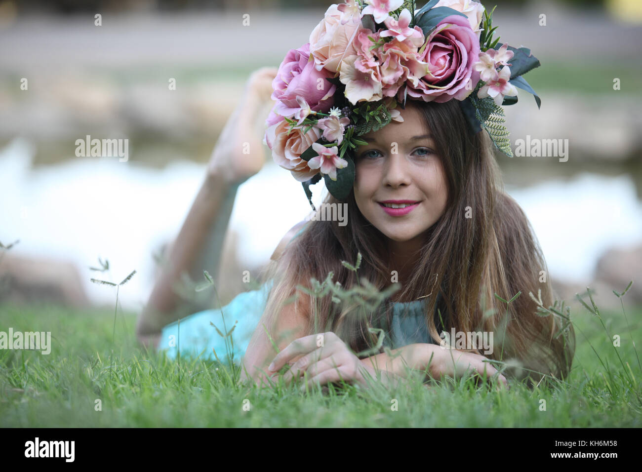 a beautiful 12 year old girl dressed up in a light blue dress, wearing ...
