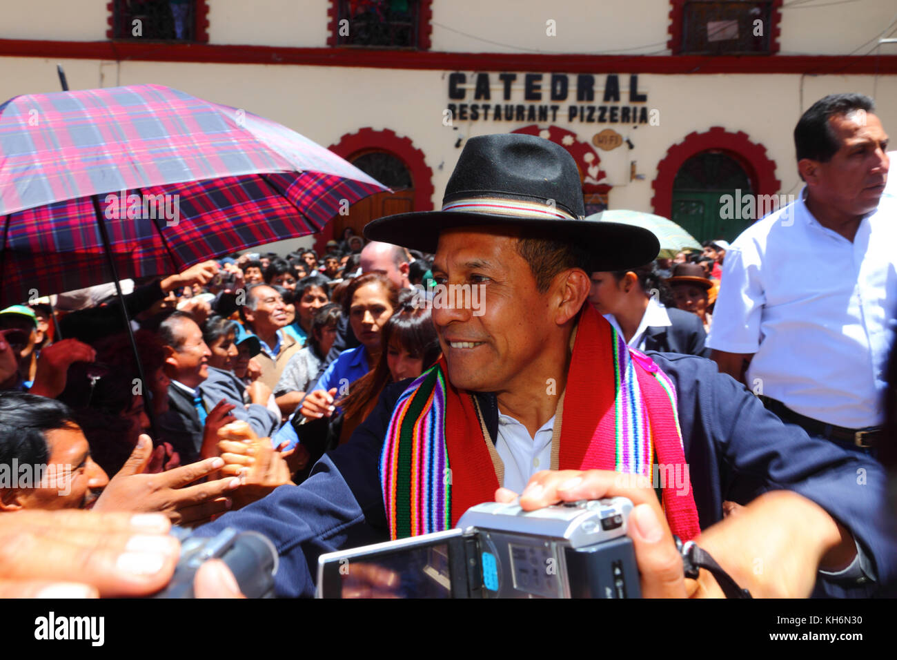 Peruvian president Ollanta Humala greets crowds as he arrives in Puno ...