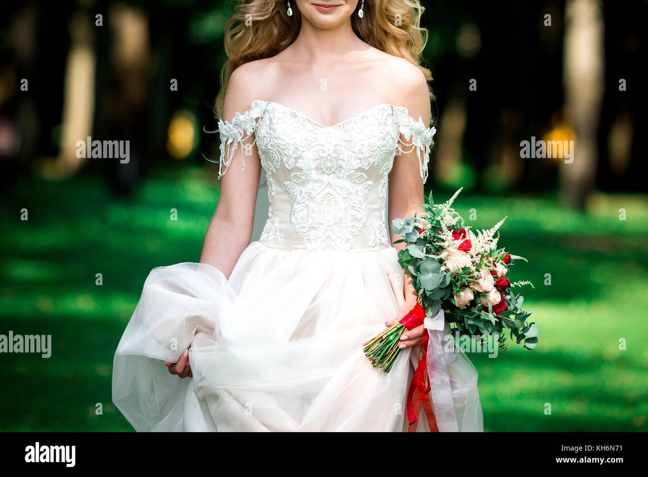 Beautiful Bride holding big wedding bouquet on wedding ceremony Stock ...