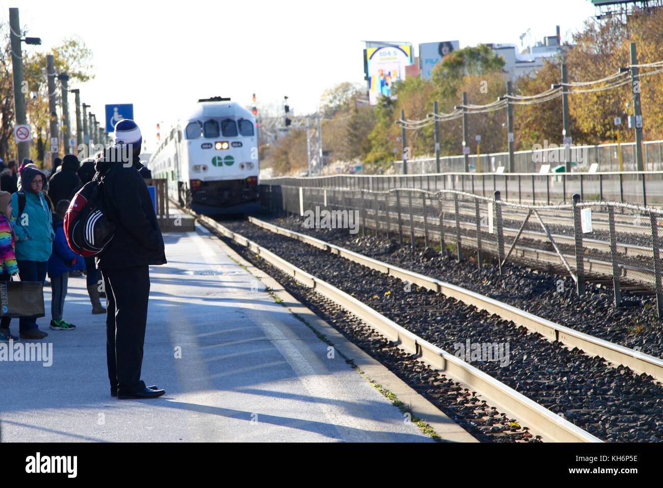 Man waiting as the GO train pull into Exhibition station in Toronto ...