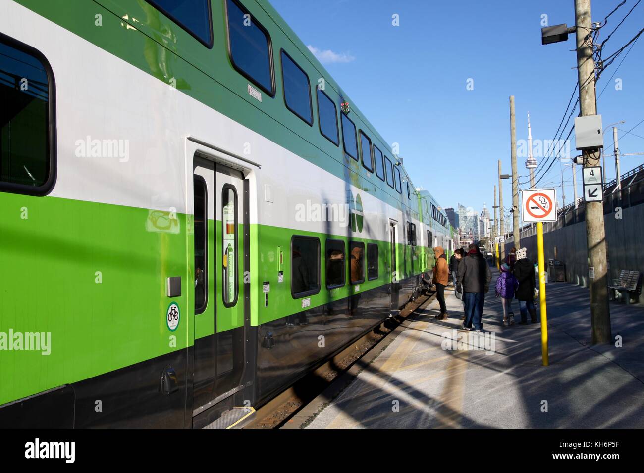 Passengers board the GO train at Exhibition station in Toronto Stock ...