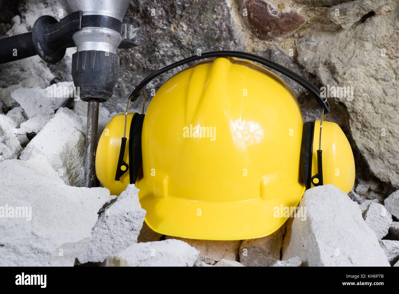 Demolition of walls. Electric hammer helmet and hearing protection ...