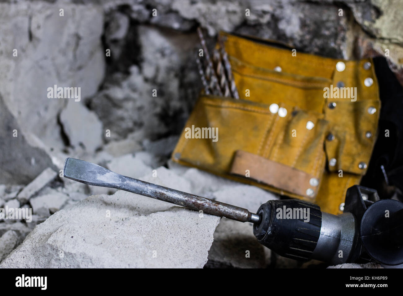 Demolition of walls. Electric hammer helmet and hearing protection ...
