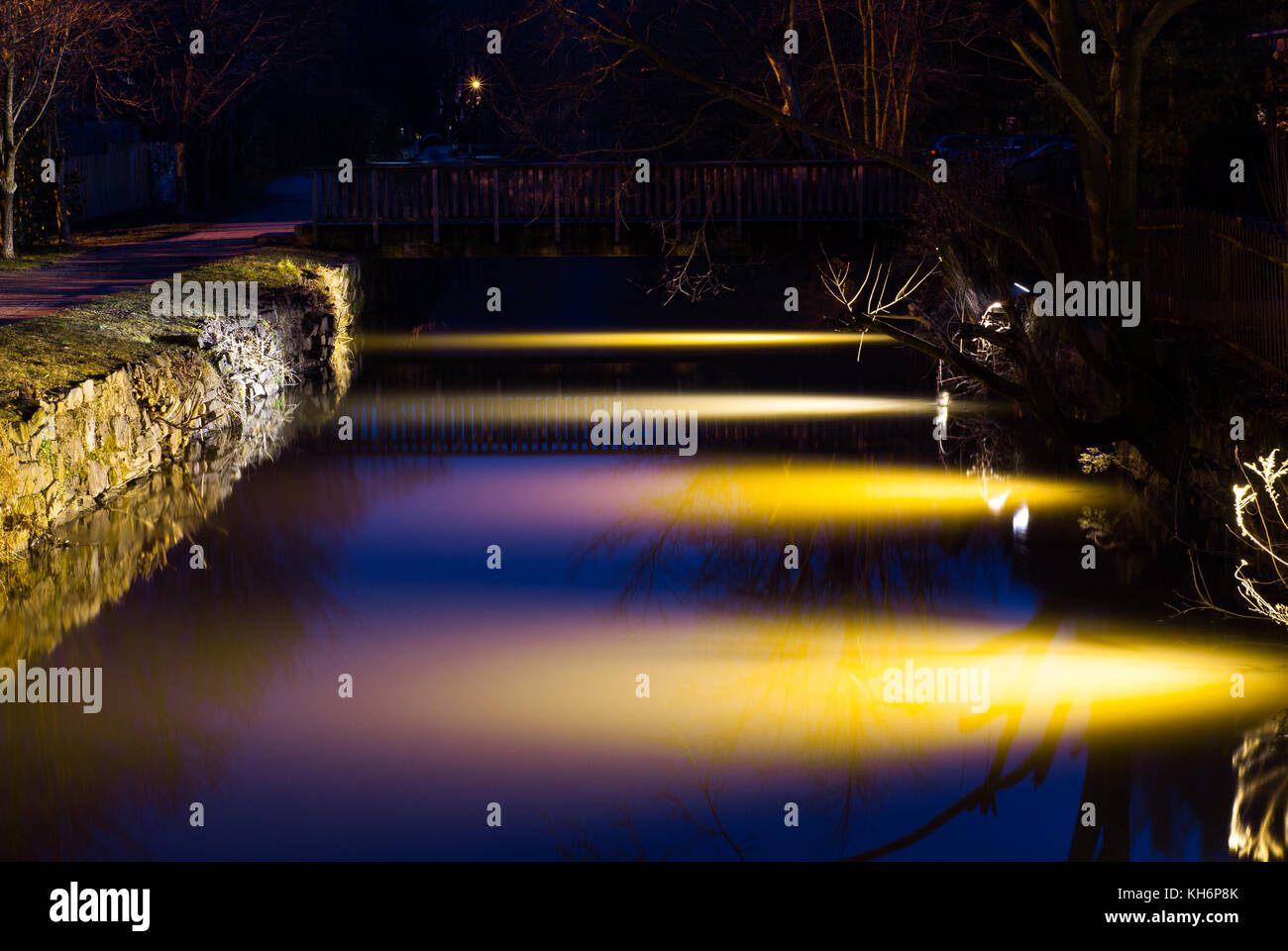 A lighted stream at night Stock Photo - Alamy